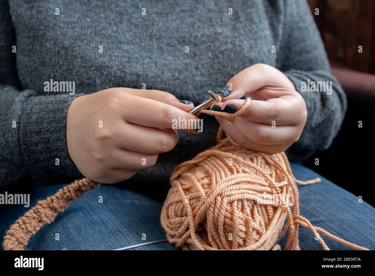Women's hands knit from color wool. Hand knitting Stock Photo - Alamy