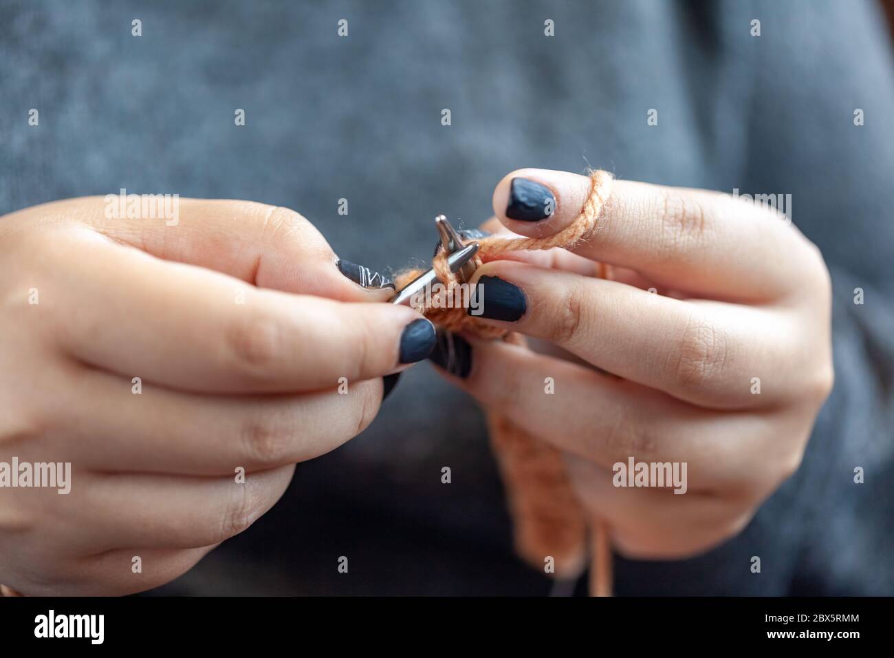 Women's hands knit from color wool. Hand knitting Stock Photo - Alamy