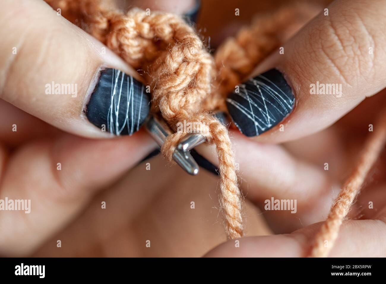 Women's hands knit from color wool. Hand knitting Stock Photo - Alamy