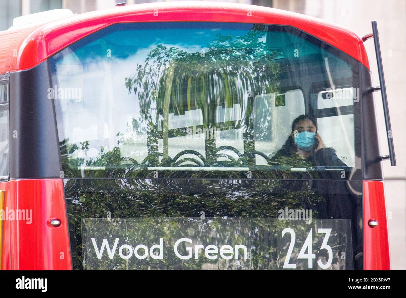 London bus face covering hi-res stock photography and images - Alamy