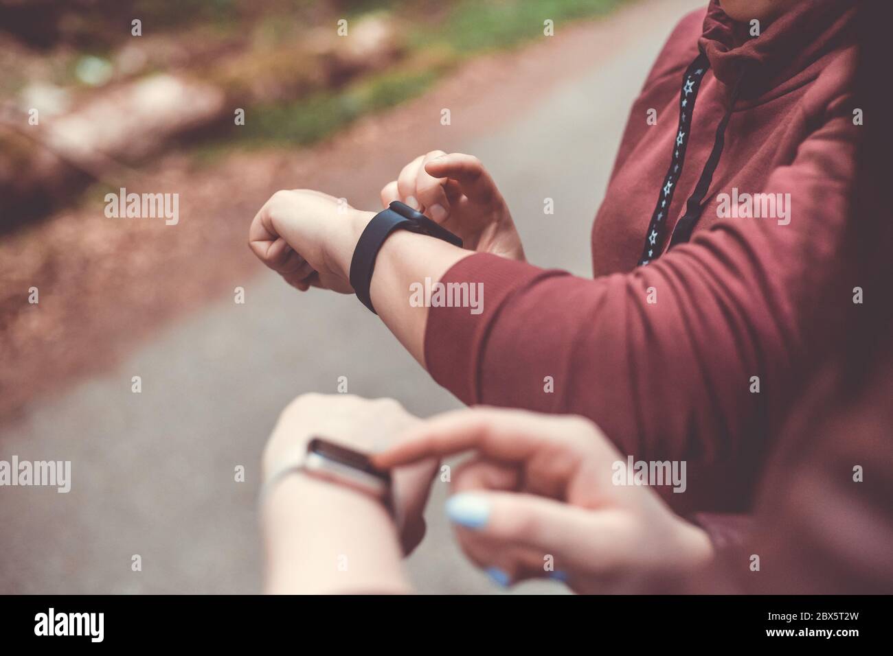 Young girls with smartwatch on the hand, modern technology Stock Photo ...