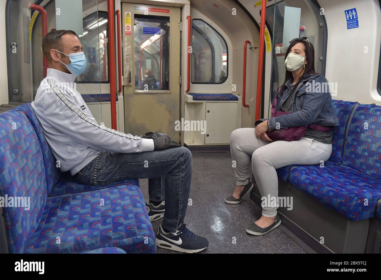 Passengers wear face masks on a Central Line underground train ...