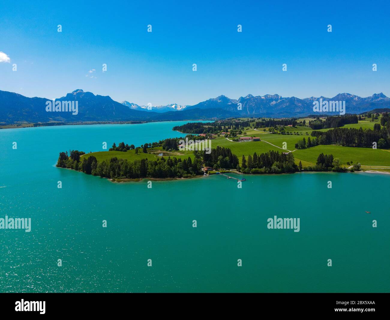 Aerial view over Lake Forggensee at the city of Fuessen in Germany ...