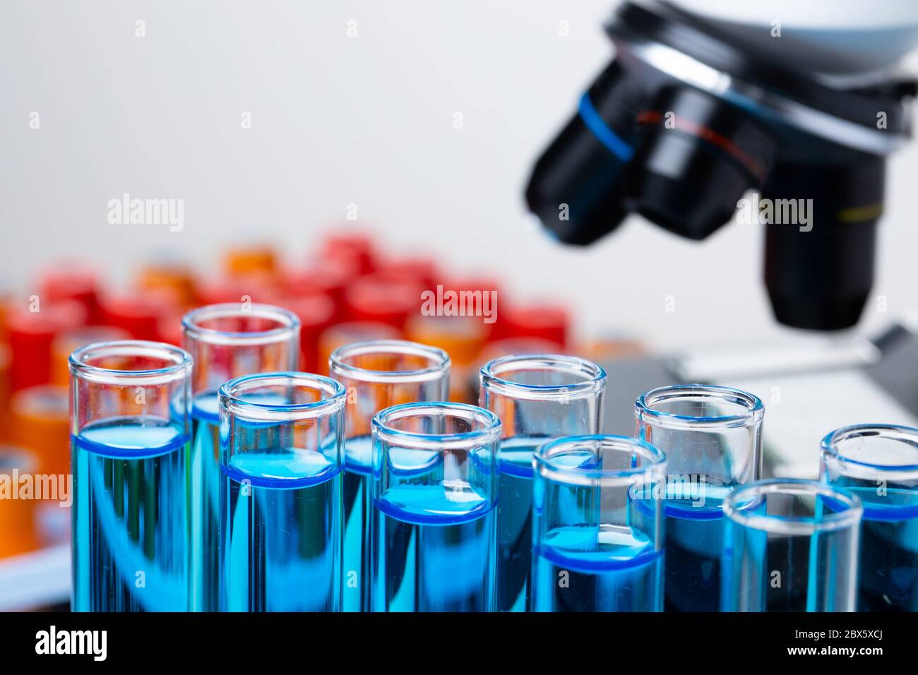 Microscope with test tubes for research close up Stock Photo - Alamy