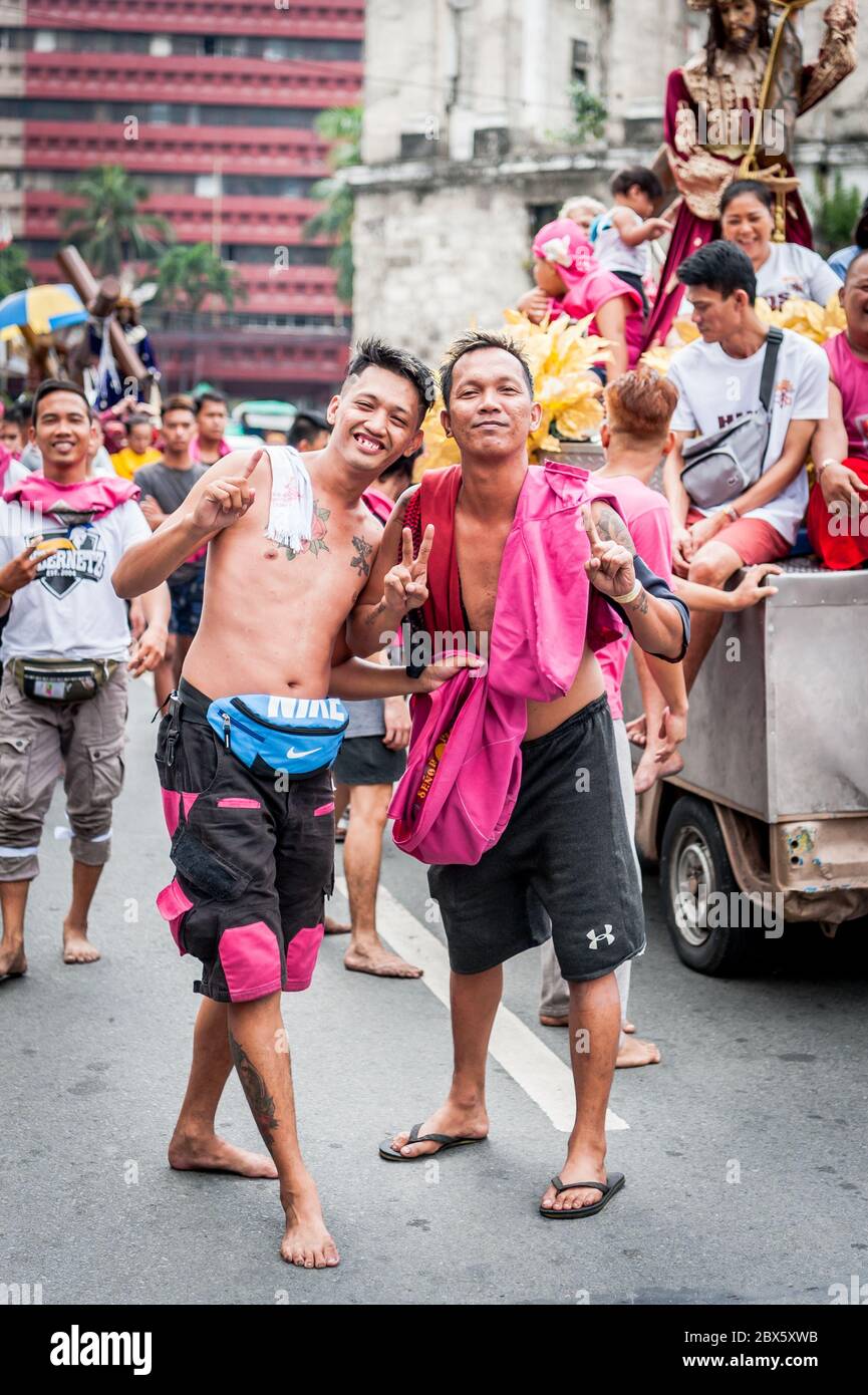 Young Filipino men joke around before heading out on the famous annual ...