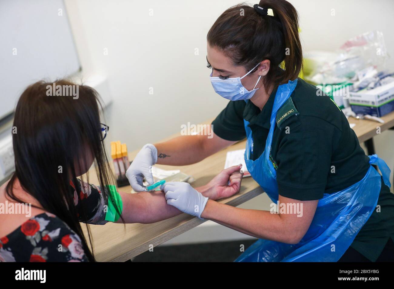 Paramedic right takes blood sample from medical hi-res stock ...