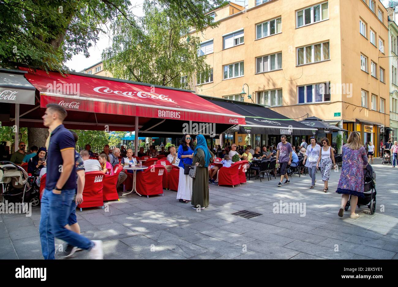 People sitting and rest at the coffee terrace of famous Ferhadija ...
