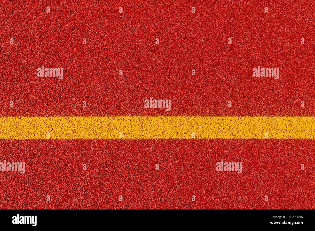 Single yellow line in running court athlete stadium, top view, rubber ...
