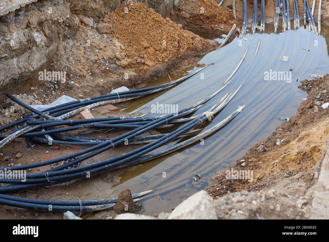 Cable cord laying in subsoil waters at construction site Stock Photo ...