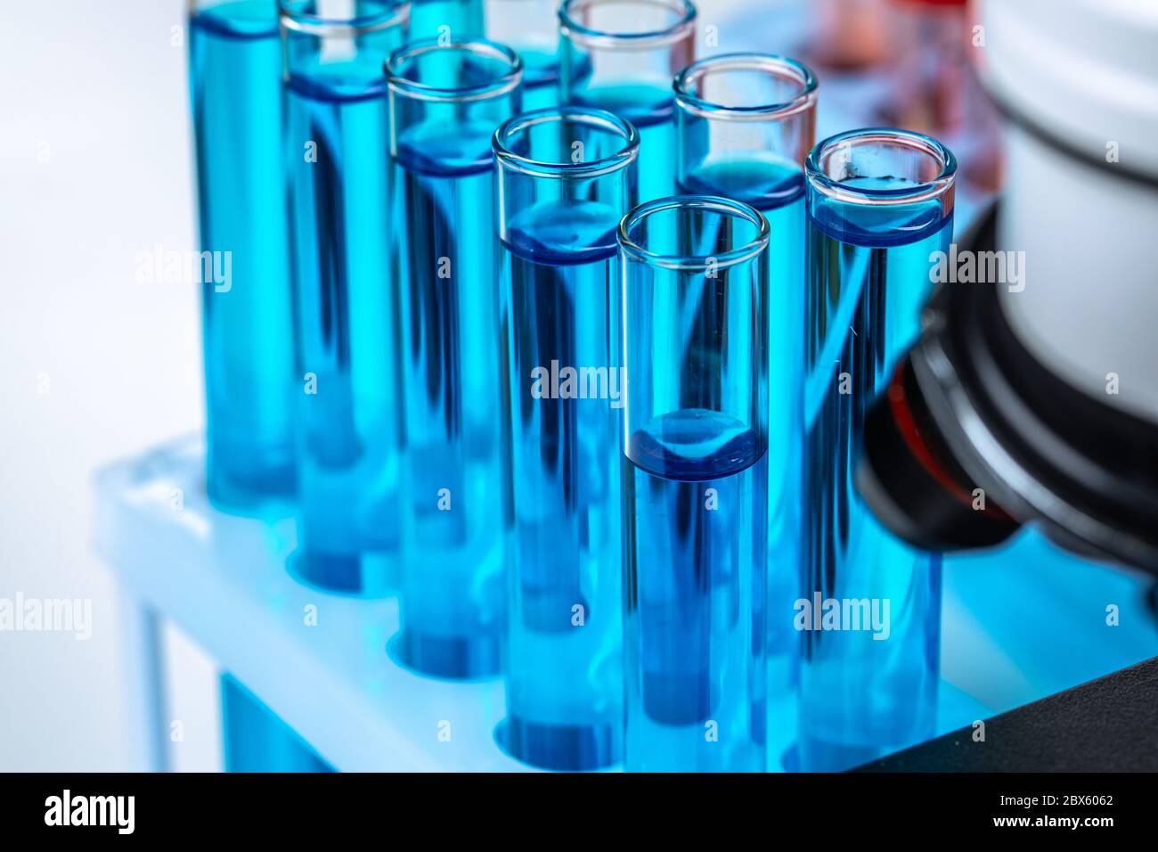 Laboratory test tubes with blue liquid close up Stock Photo - Alamy