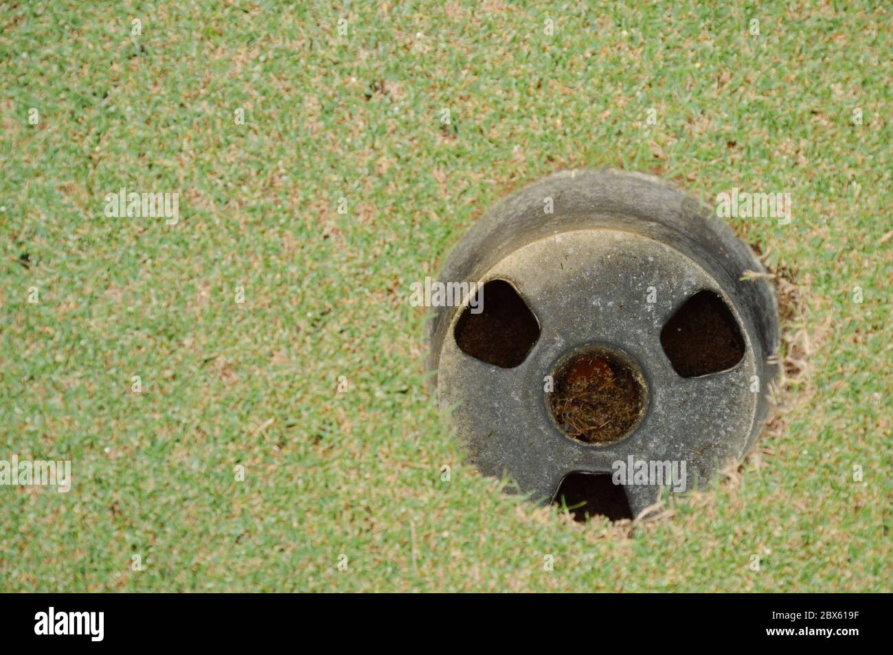 hole on green golf court field in sunny day Stock Photo - Alamy