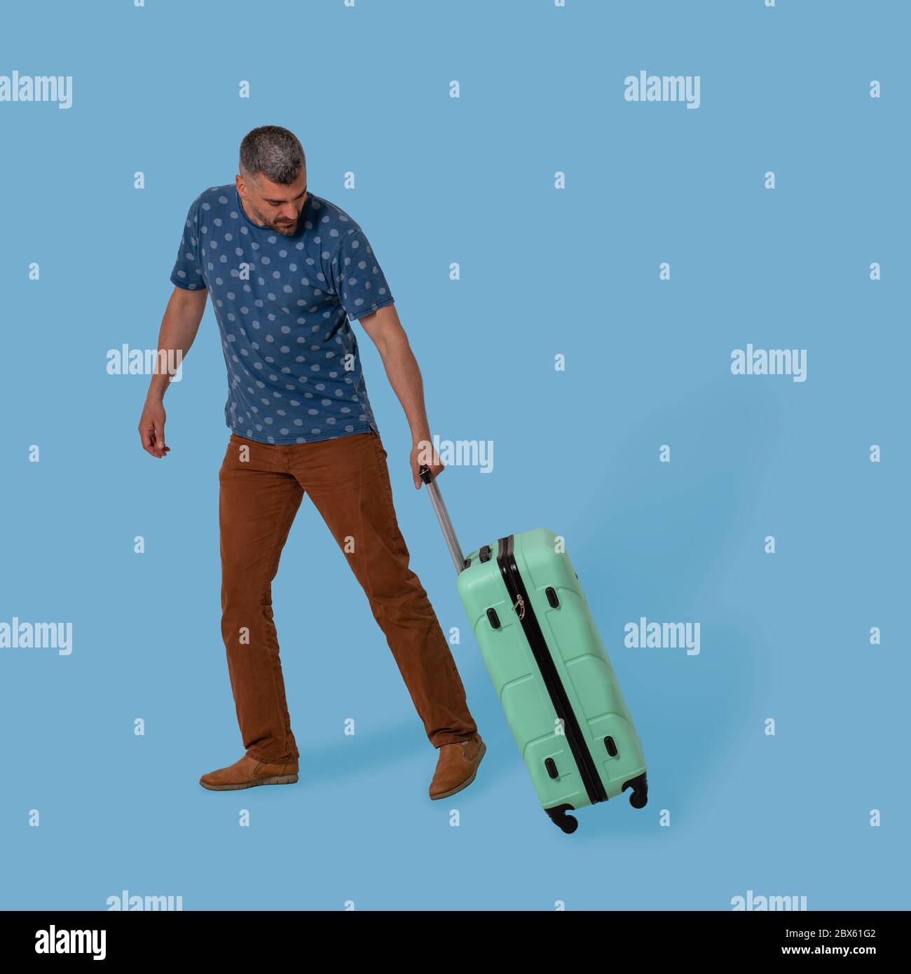 Man carries suitcase hi-res stock photography and images - Alamy