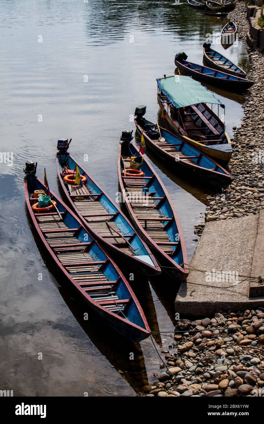 Amazon river with small colorful boats, transportation in the river ...