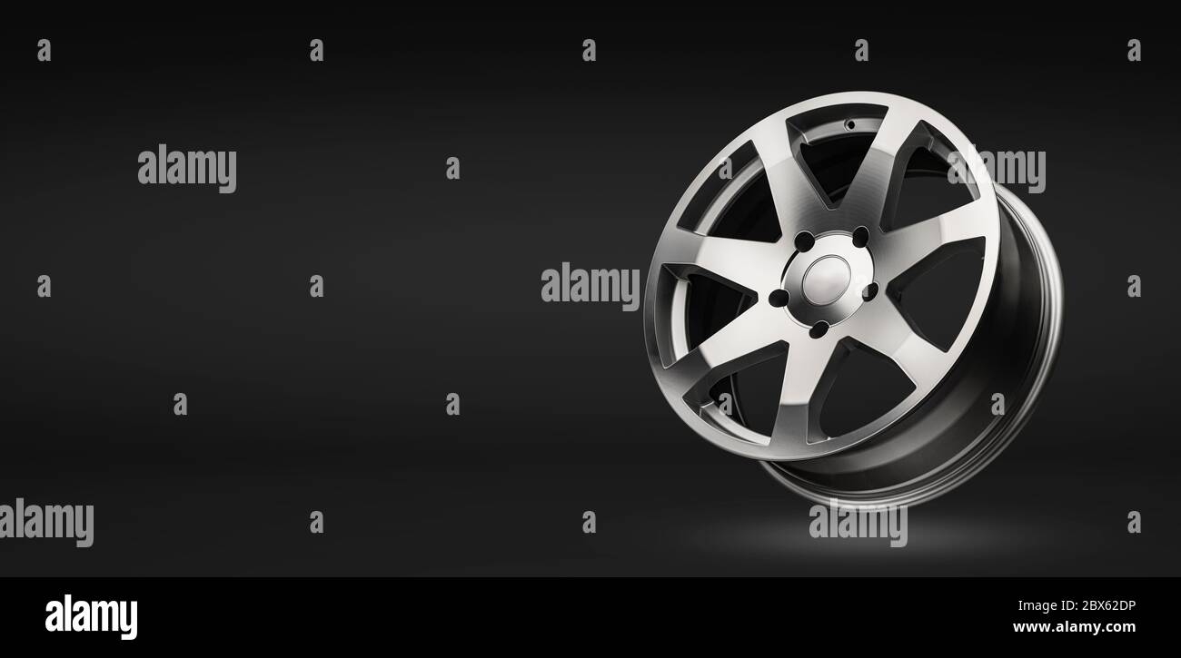 silver aluminum alloy wheel, on a black gradient background. copy space ...