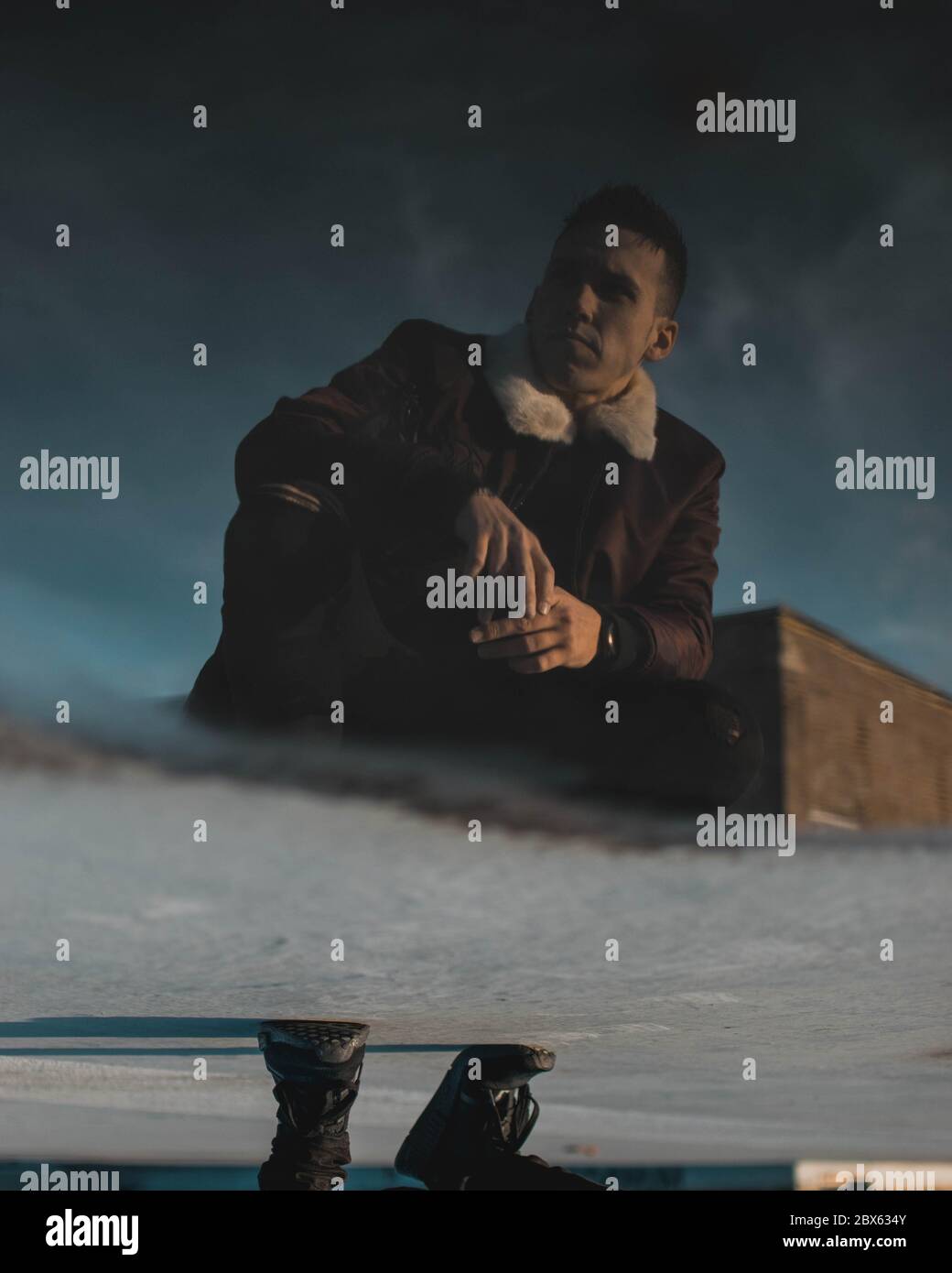 Reflection of Man in Puddle, Upside Down Illusion Stock Photo - Alamy