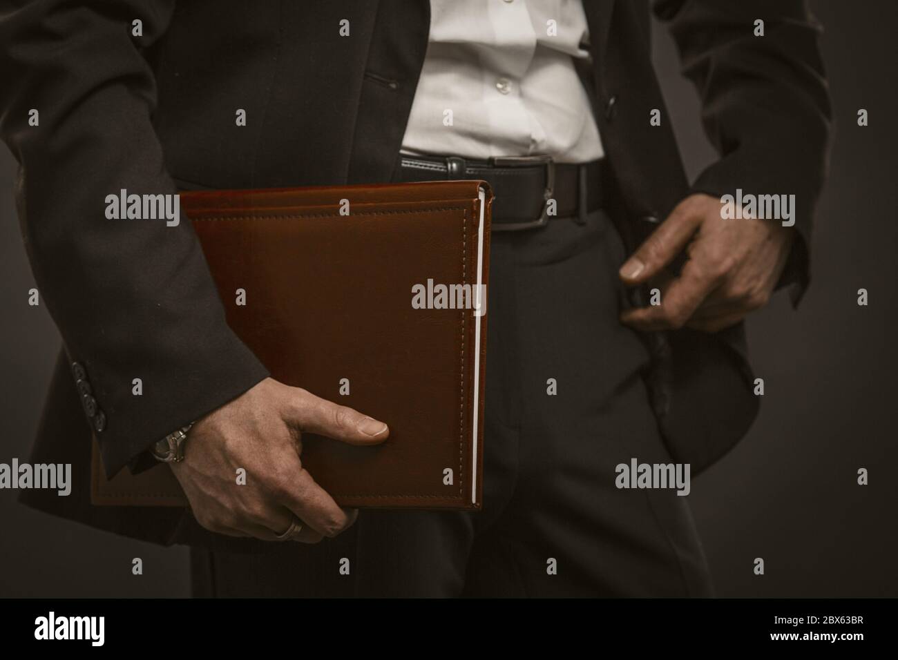 Successful businessman holds documents folder. Good looking caucasian ...