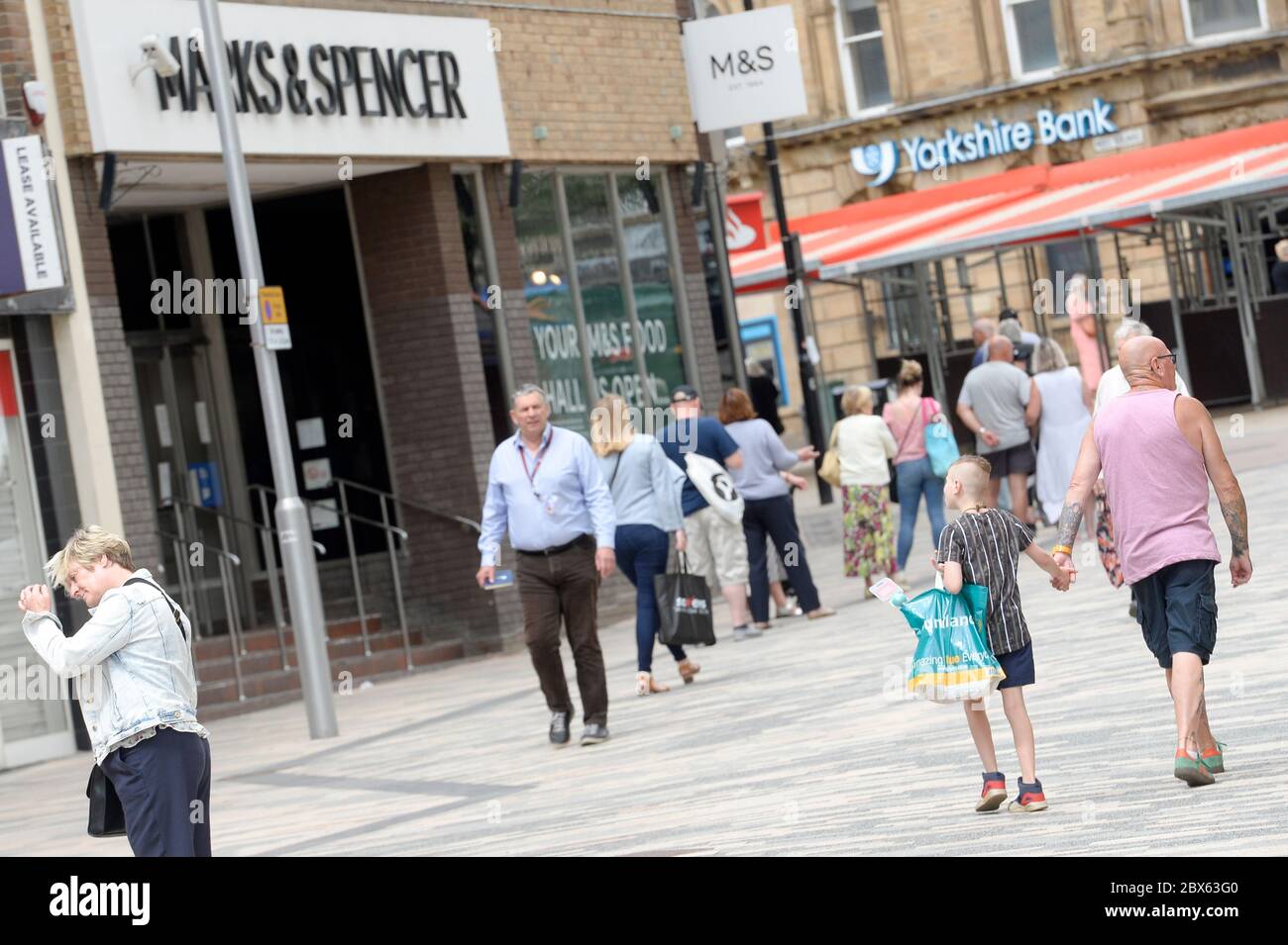Shoppers in Barnsley town centre on Cheapside browsing the shops and ...