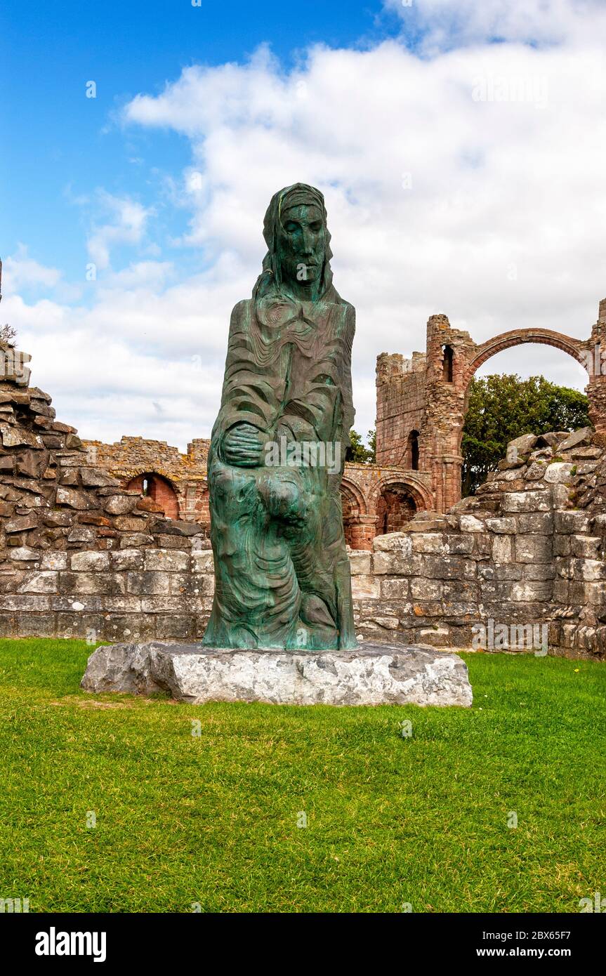 A bronze statue of St Cuthbert sculpted by Fenwick Lawson is situated ...
