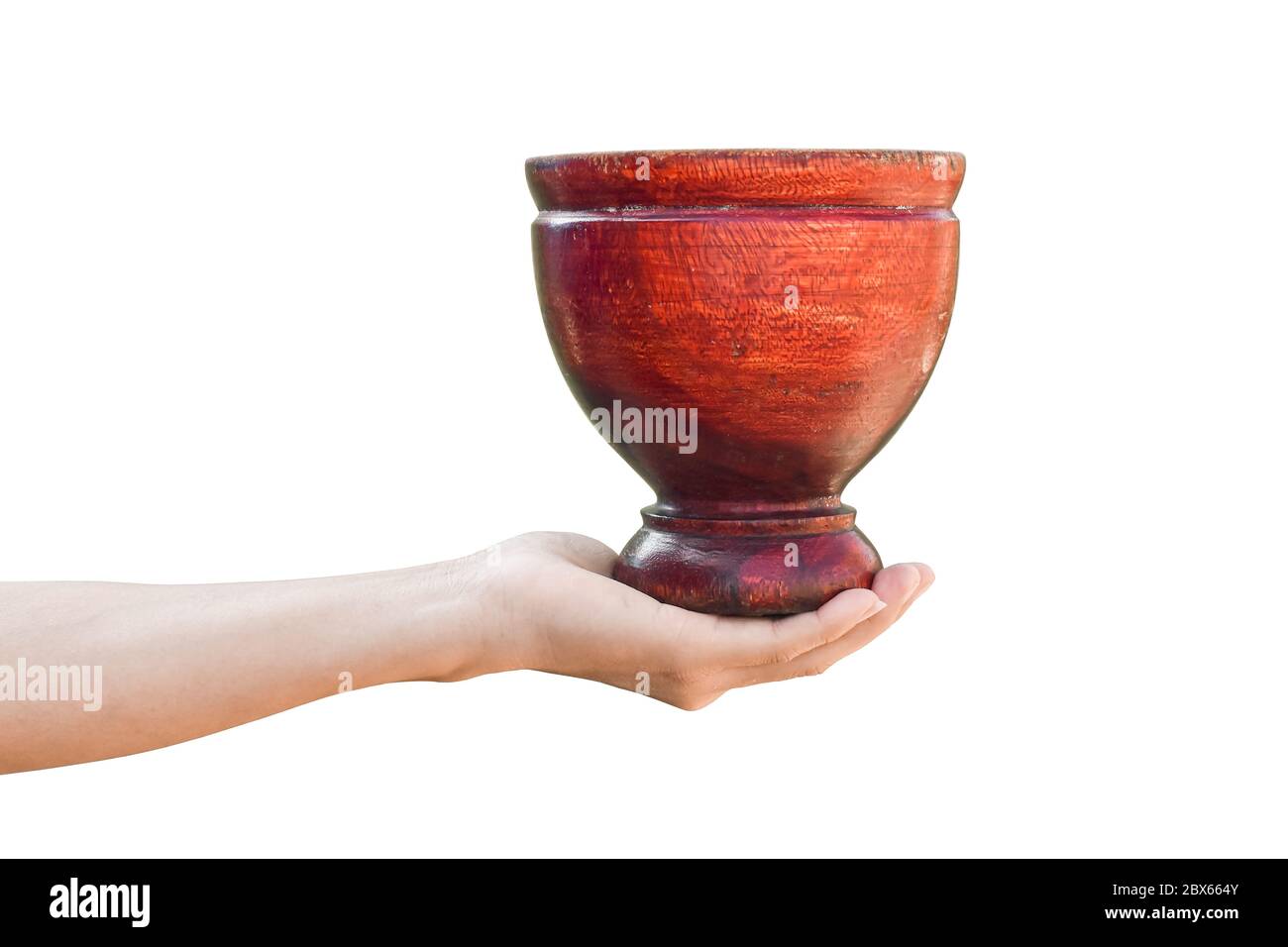 hand holding wooden mortar isolated on white background with clipping ...