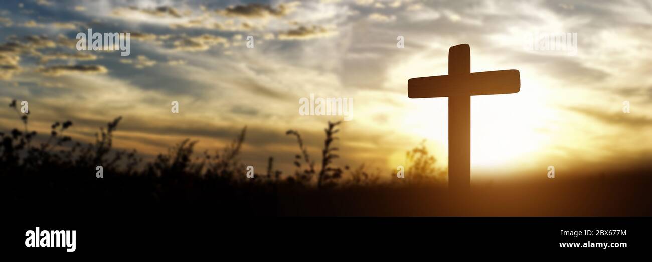 Silhouette of catholic cross at sunset background. panorama picture ...