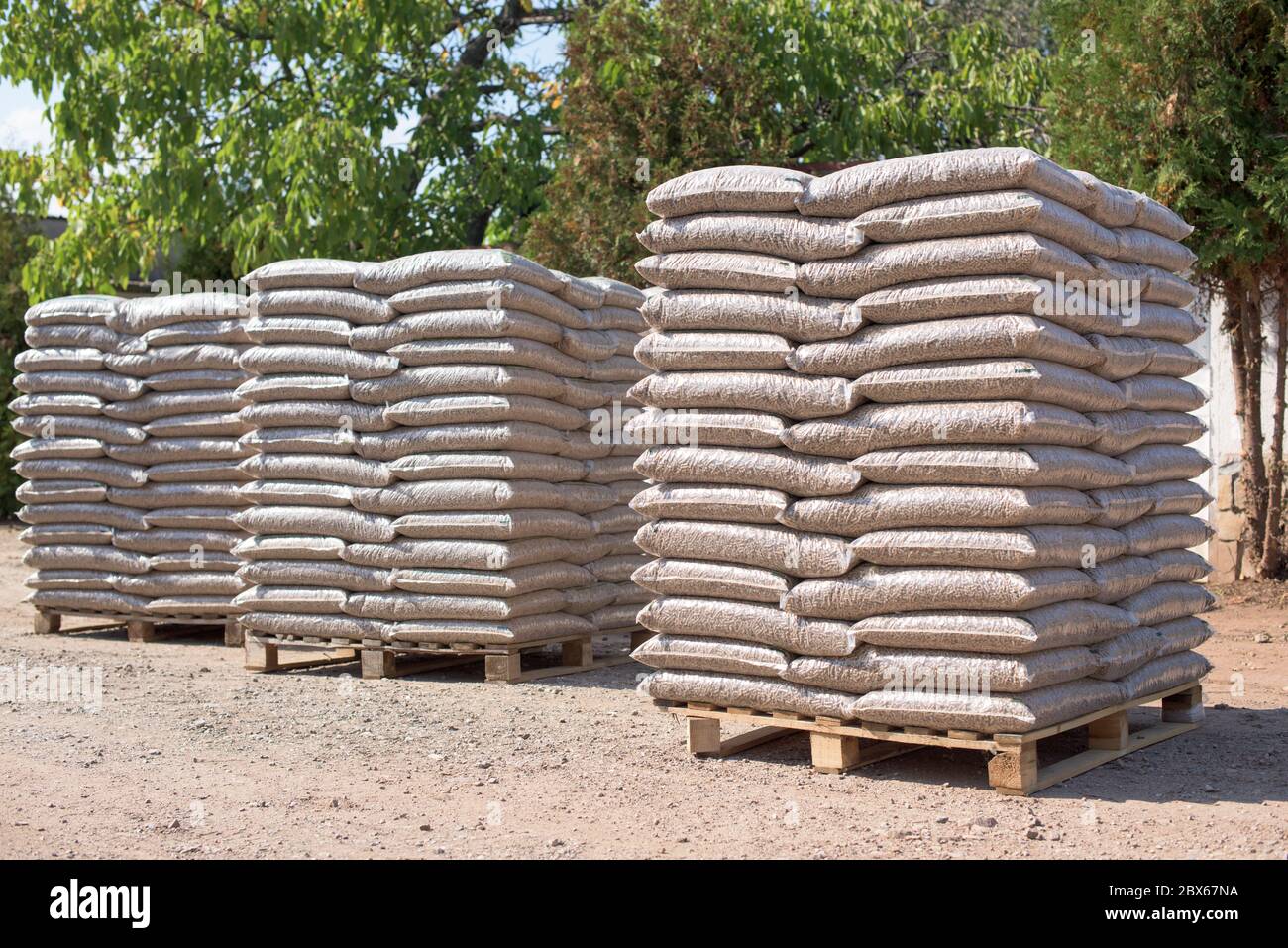 Many sacks that are filled with pellets placed on pallets Stock Photo ...