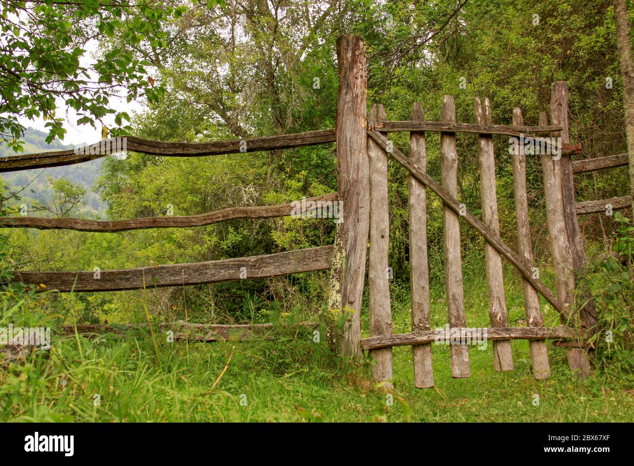 Wooden fence of a mountain village garden in Romania. Outdoors ...