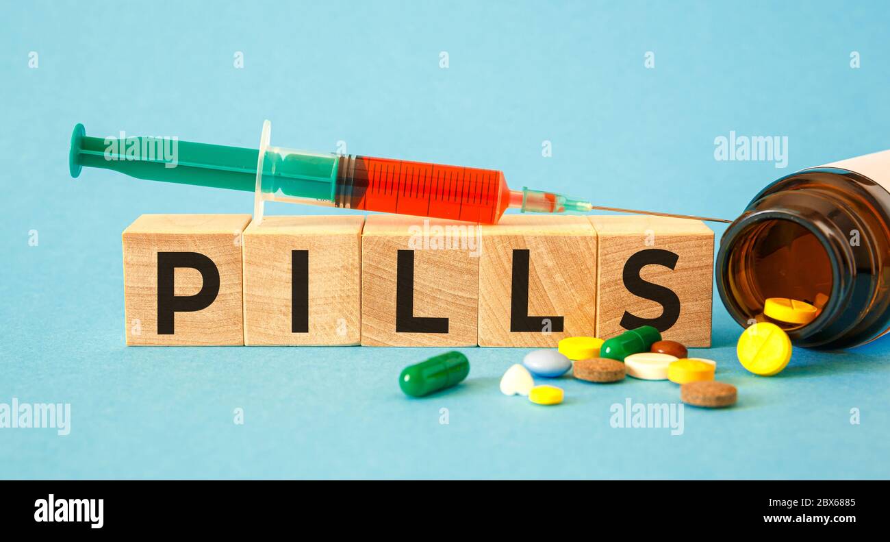 PILLS word written on wood blocks. Medical concept Stock Photo - Alamy