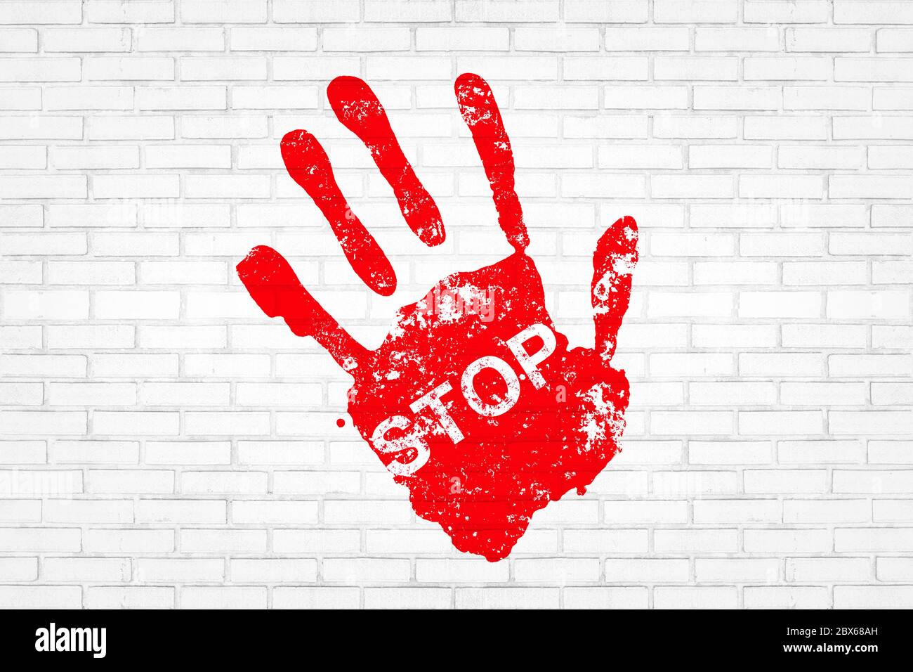Hand print with the inscription STOP on white brick wall Stock Photo ...