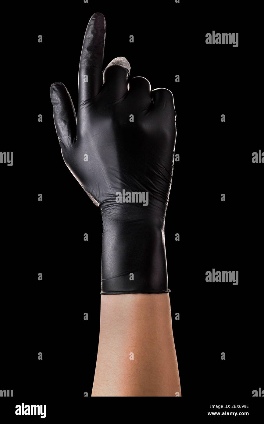 Hand in black gloves with the index finger pointing up on black Stock ...