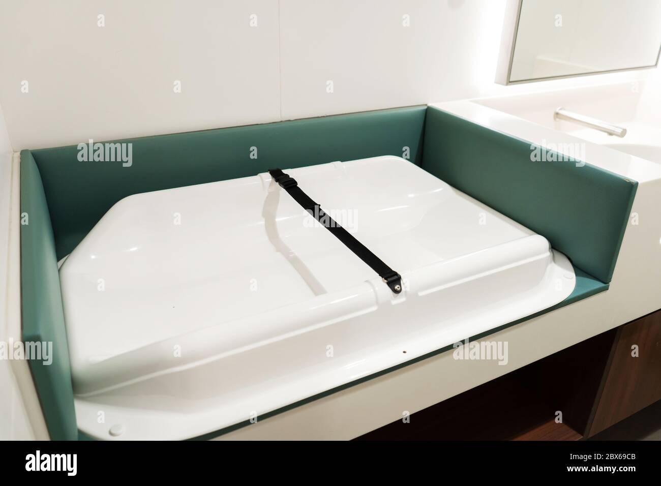 A table for changing a baby in a women's restroom Stock Photo - Alamy