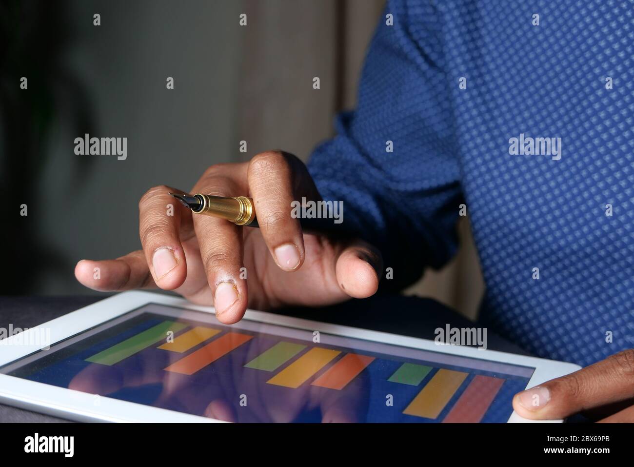 Close up of man hand analyzing charts on digital tablet, using self ...