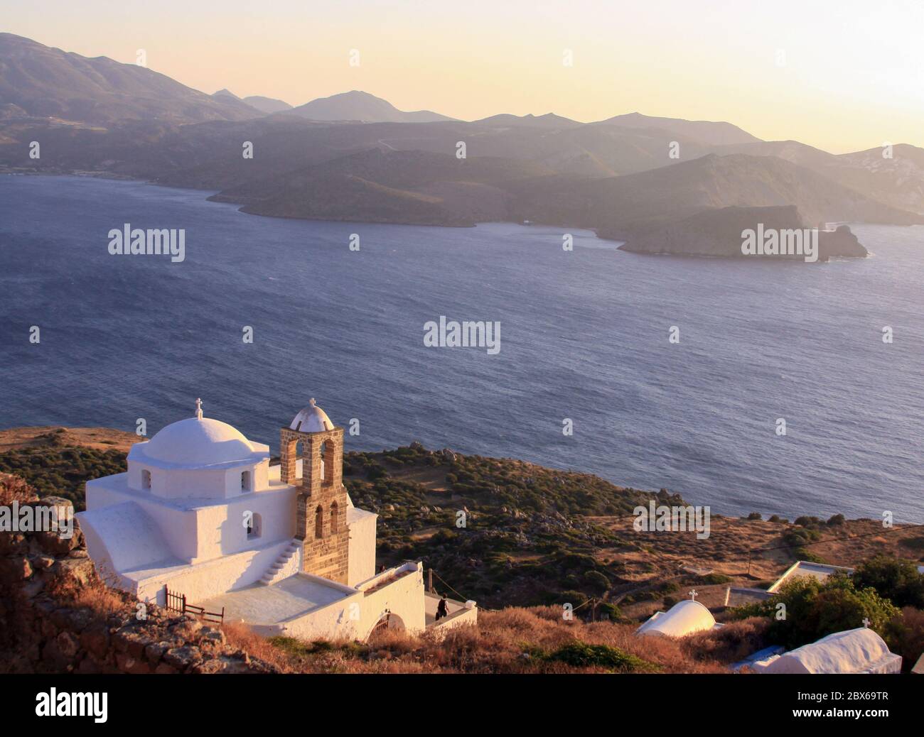 Greek church view from Plaka castle in Milos island, Cyclades, Greece ...