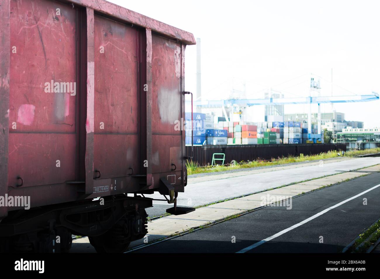 A railroad wagon on track at the dock Stock Photo - Alamy