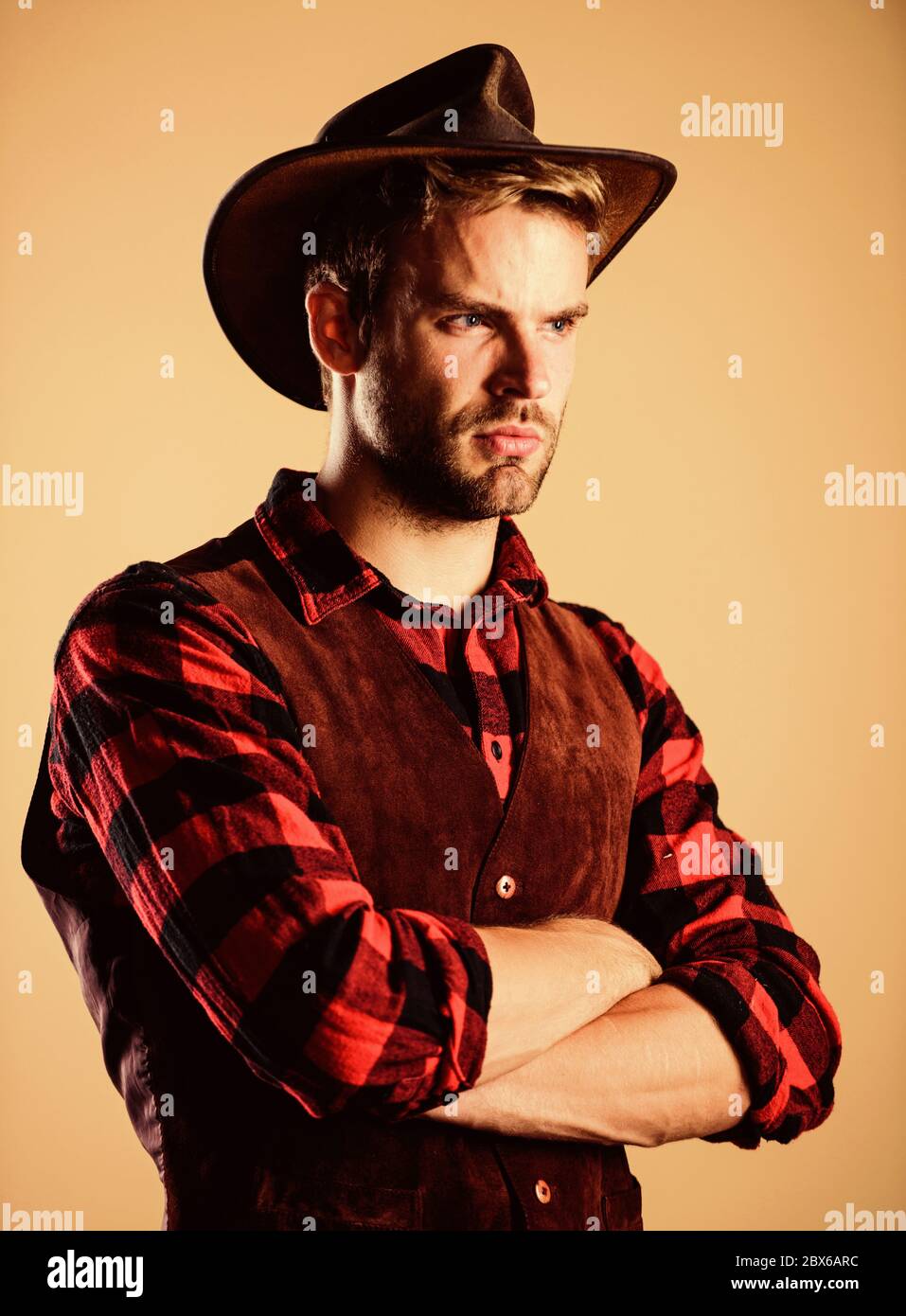 wanted. western cowboy portrait. man checkered shirt on ranch. Vintage ...