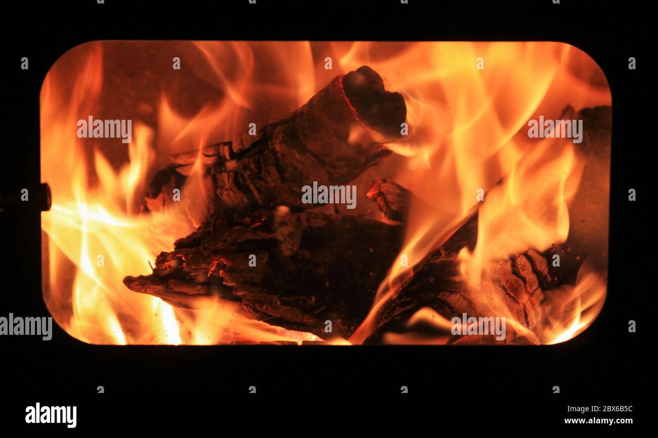 Burning wood to make fire in fireplace. Heating the house in winter ...