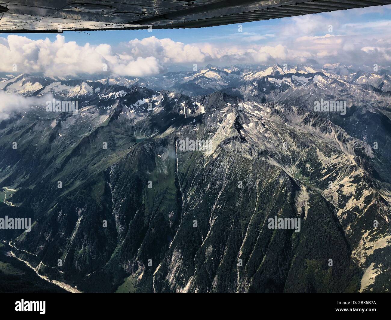 Austrian alps overflight in a small propeller plane Stock Photo - Alamy