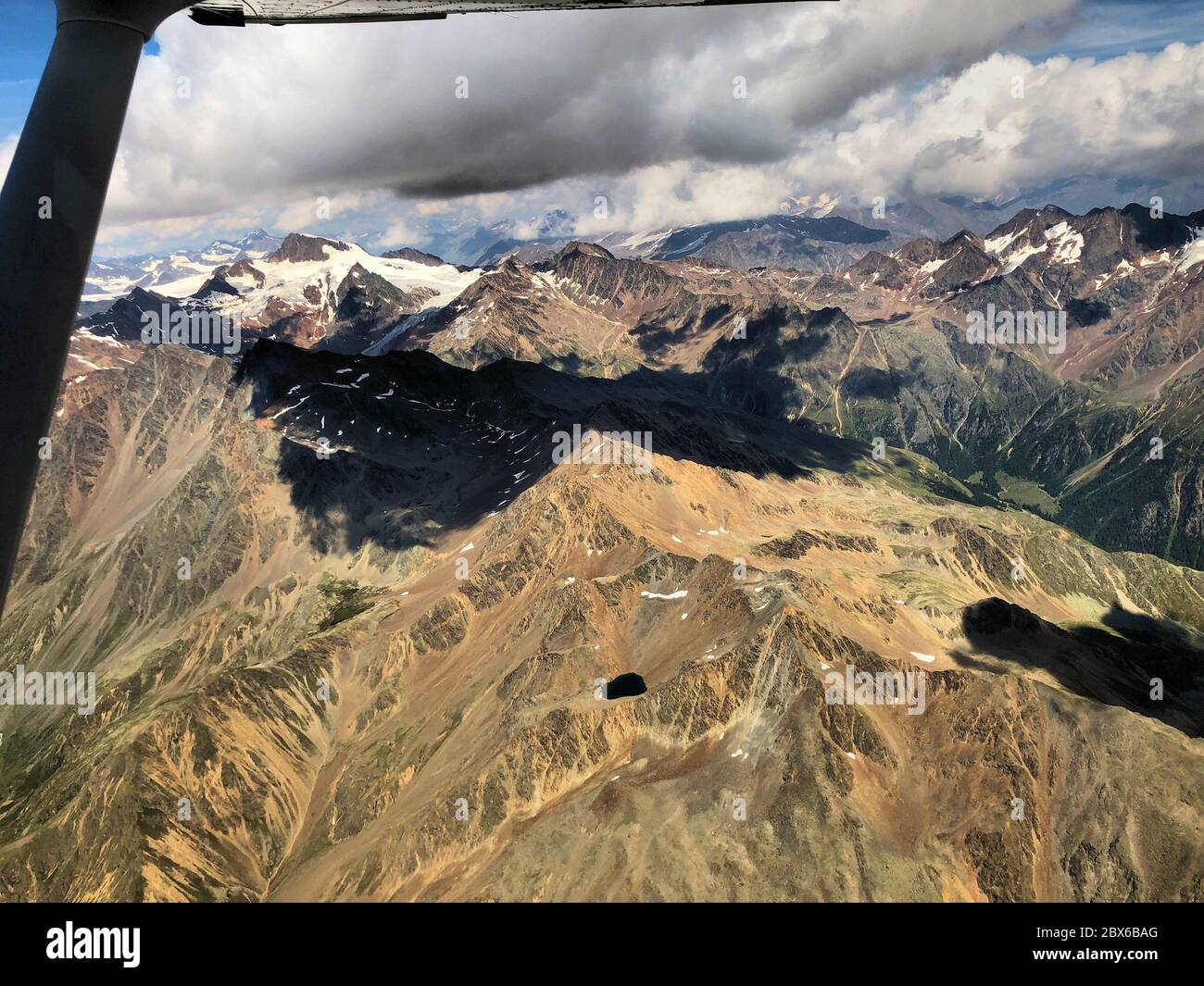 Austrian alps overflight in a small propeller plane Stock Photo - Alamy