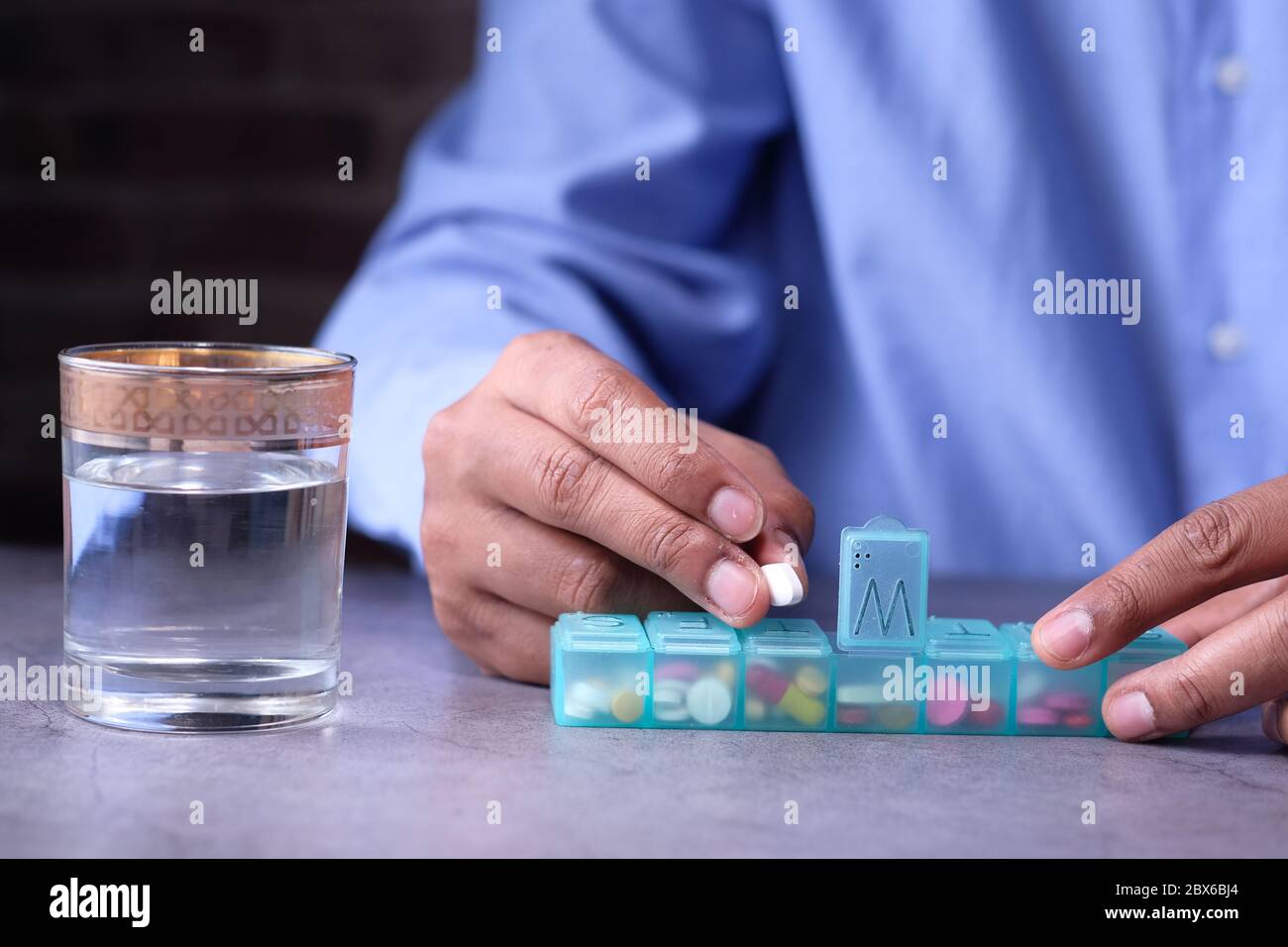 Man taking medicine from hi-res stock photography and images - Alamy