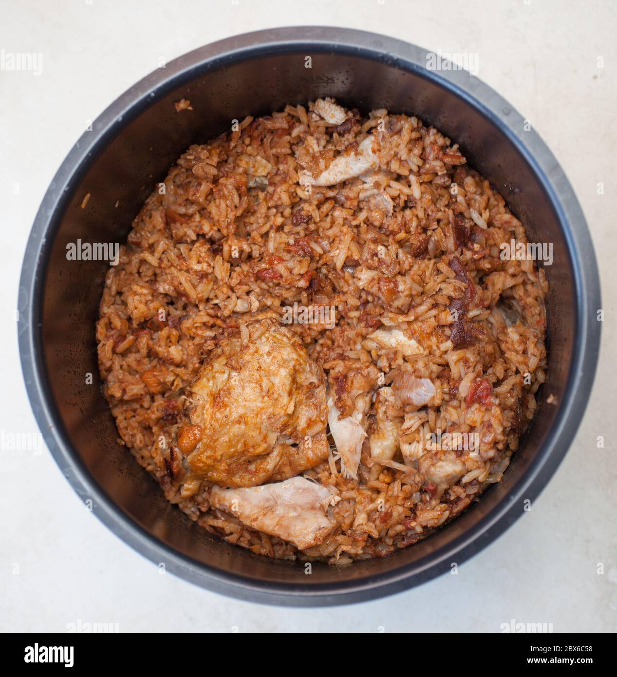 Iraqi slow cooked chicken and rice before serving Stock Photo - Alamy
