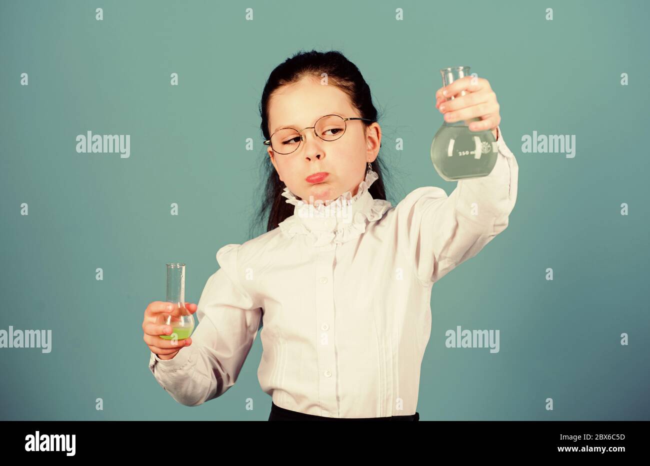 science research in lab. Small school girl. child study bilogy lesson ...