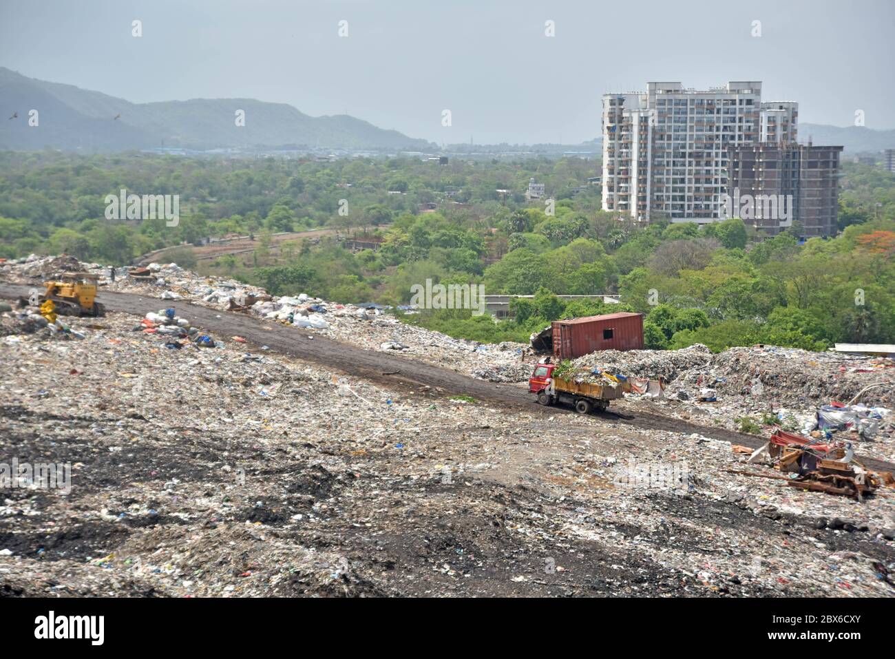 Thane, India. 05th June, 2020. Trucks carry trash to Adharwadi Dumping ...