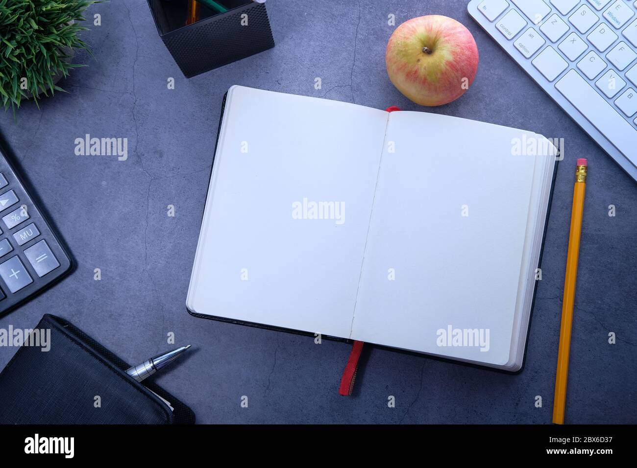 apple , open diary, books and stationary on wooden background Stock ...