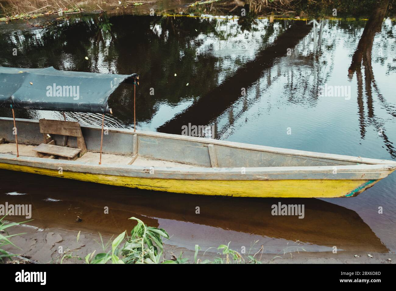 old aboriginal boat on a river in the amazon, ecuador Stock Photo - Alamy