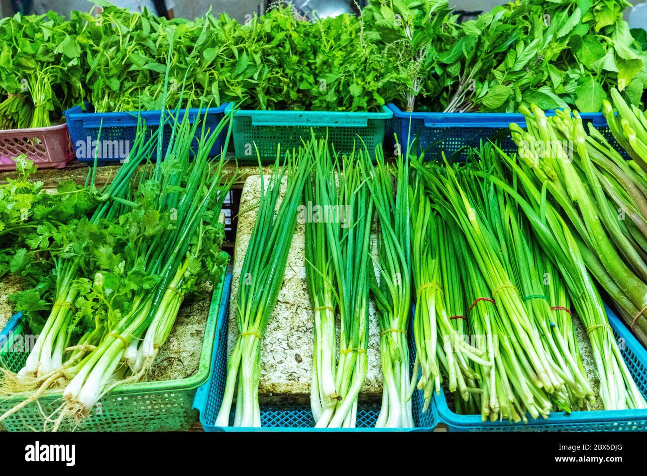Boxes with greens on a counter at the vegetable market Stock Photo - Alamy