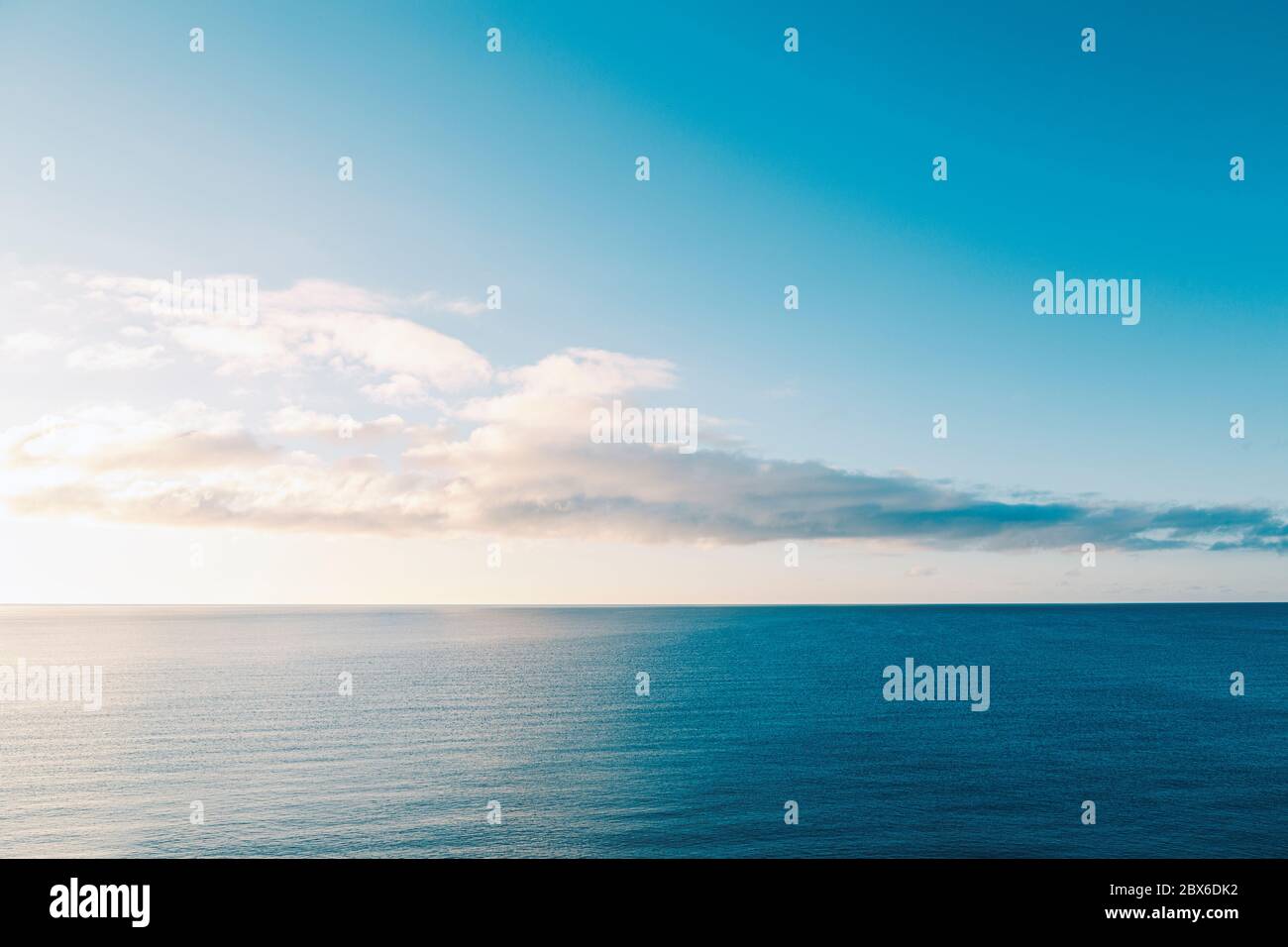 Looking out at sea during sunrise Stock Photo - Alamy