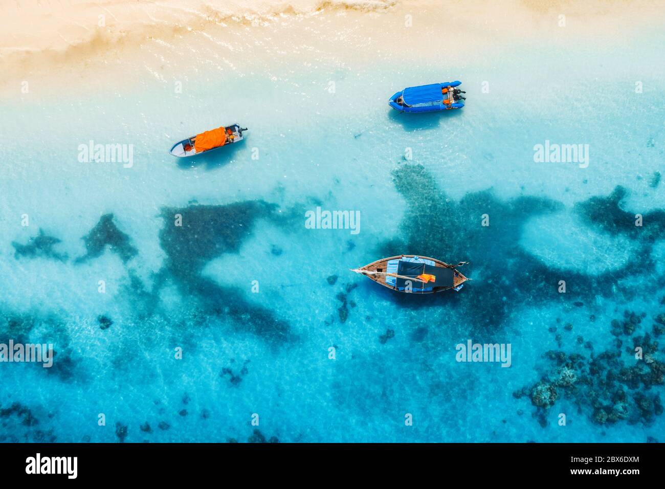 Aerial view of the fishing boats in clear blue water at sunny day Stock ...