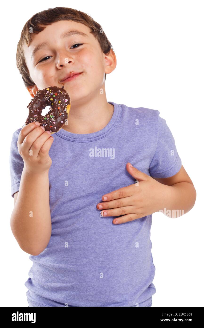 Young boy child eating donut unhealthy sweet sweets isolated on a white ...