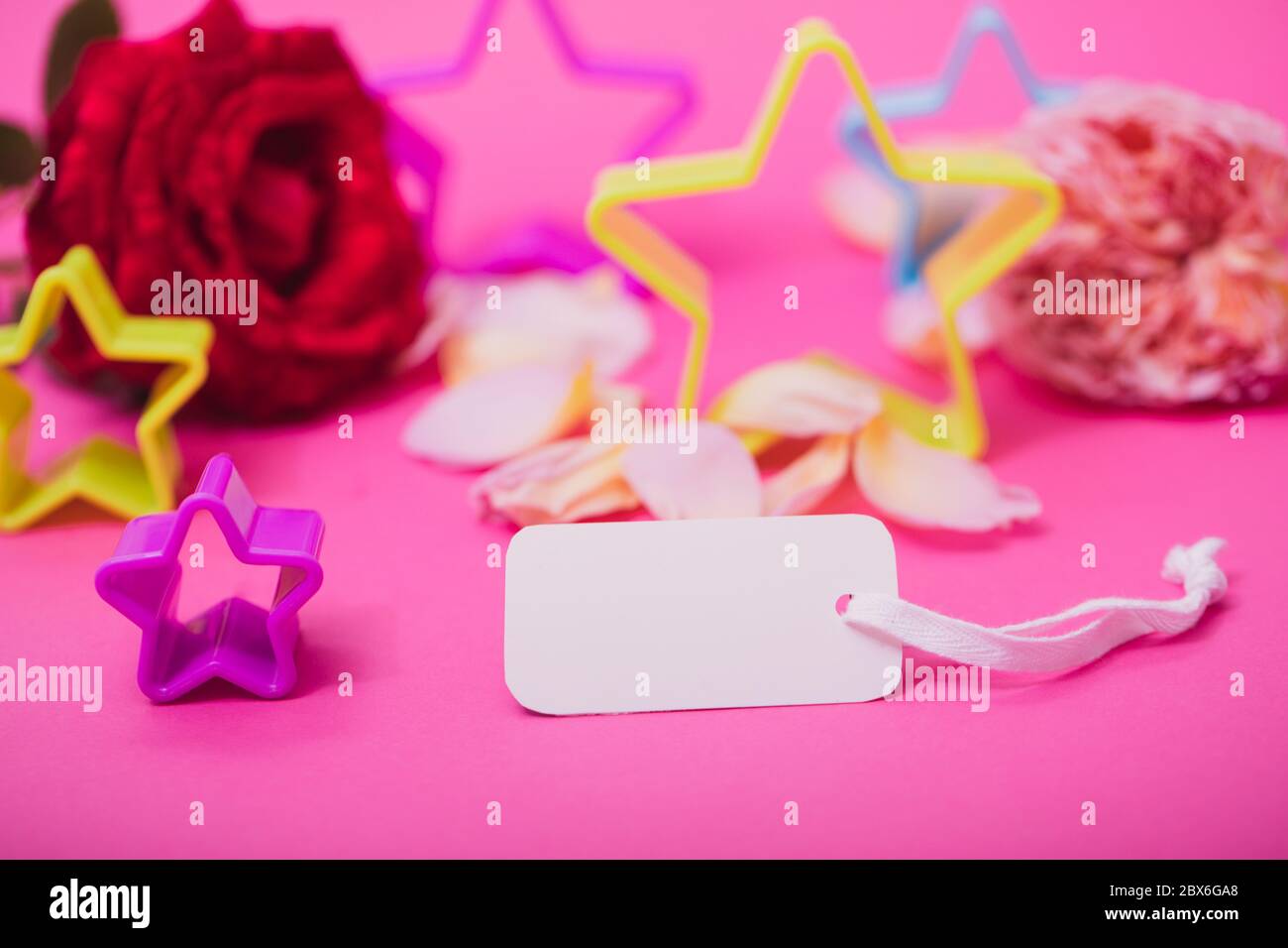 White empty card and stars on pink background. Greeting card festive ...