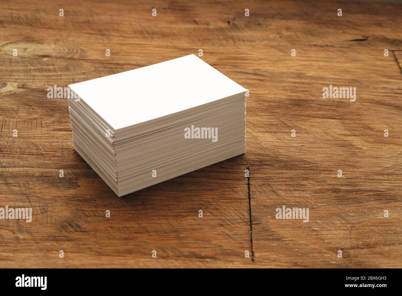 Blank businesscard stacks on rough wooden table Stock Photo - Alamy