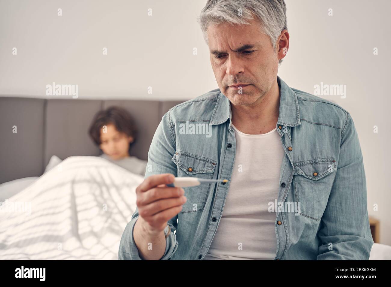 Little child staying sick in bed at home Stock Photo - Alamy